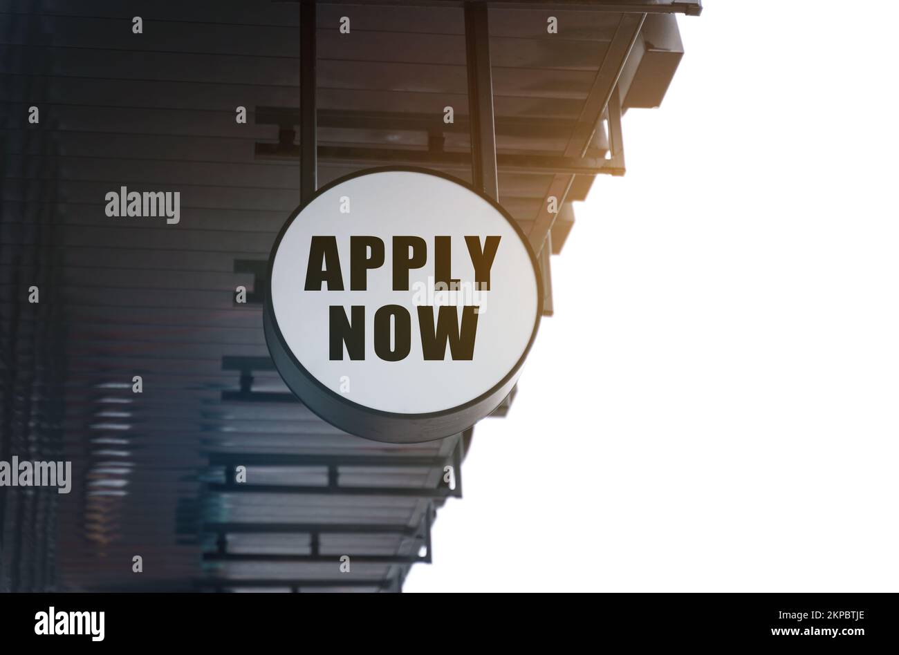 Business and Economics. There is a circular sign under the roof of the ...