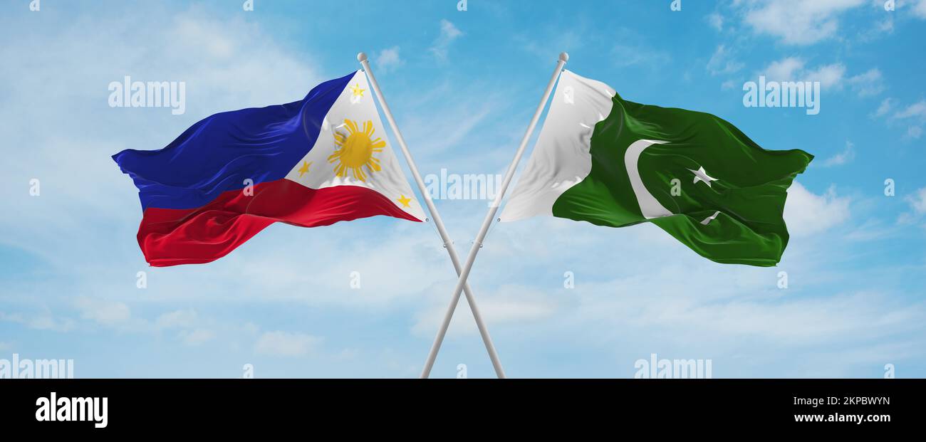 two crossed flags Pakistan and Philippines waving in wind at cloudy sky ...