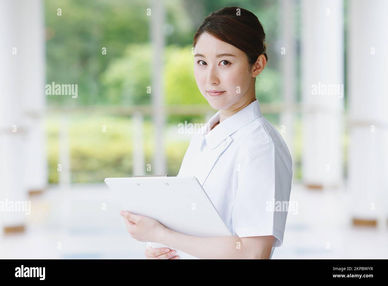 Young Japanese female nurse in the hallway Stock Photo - Alamy