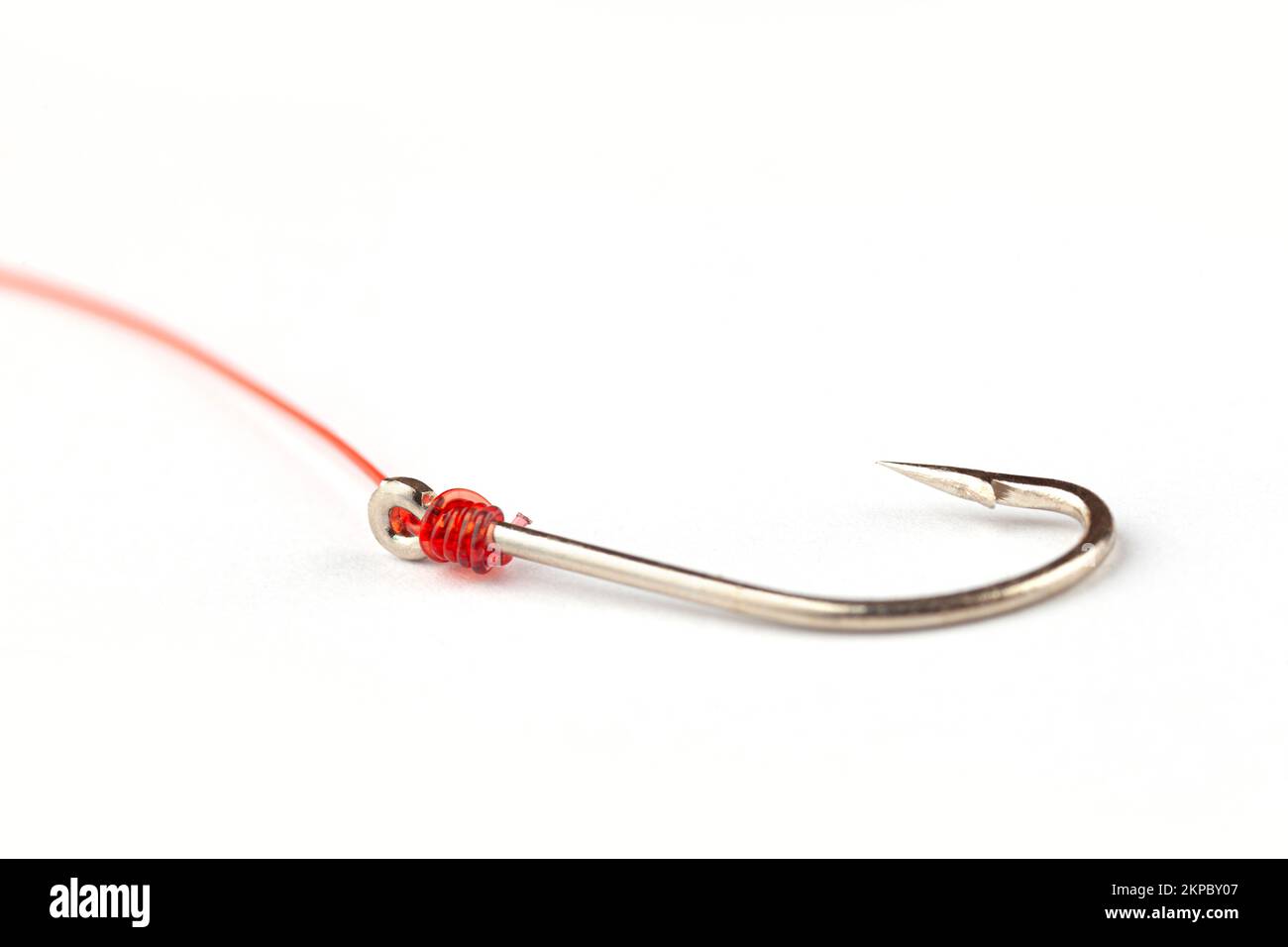 fishing hook with fishing line on white background. Blurred concept ...