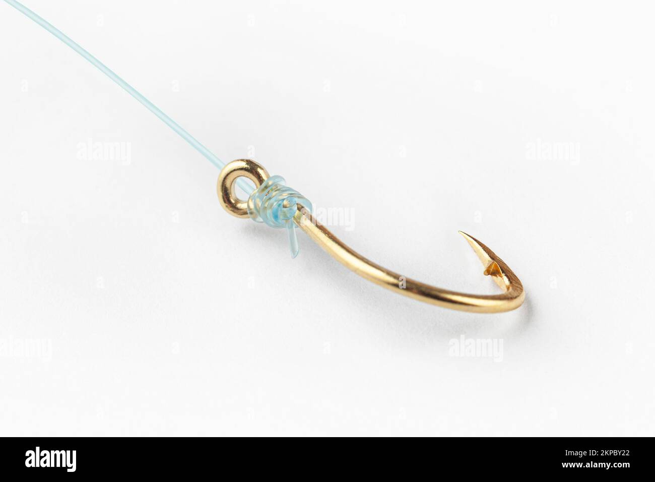 fishing golden hook with fishing line on white background. Blurred ...
