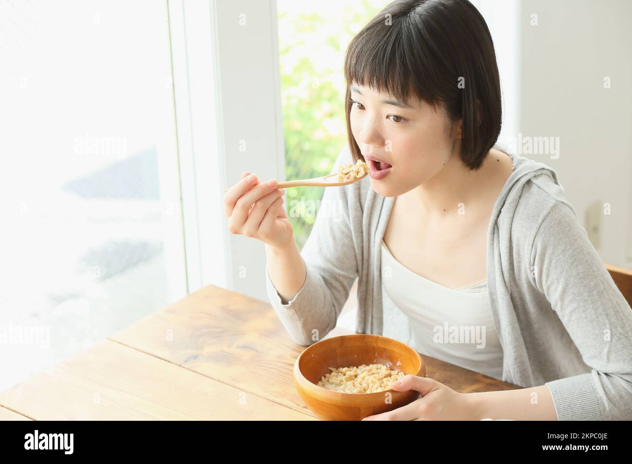 Young Japanese woman having breakfast Stock Photo - Alamy