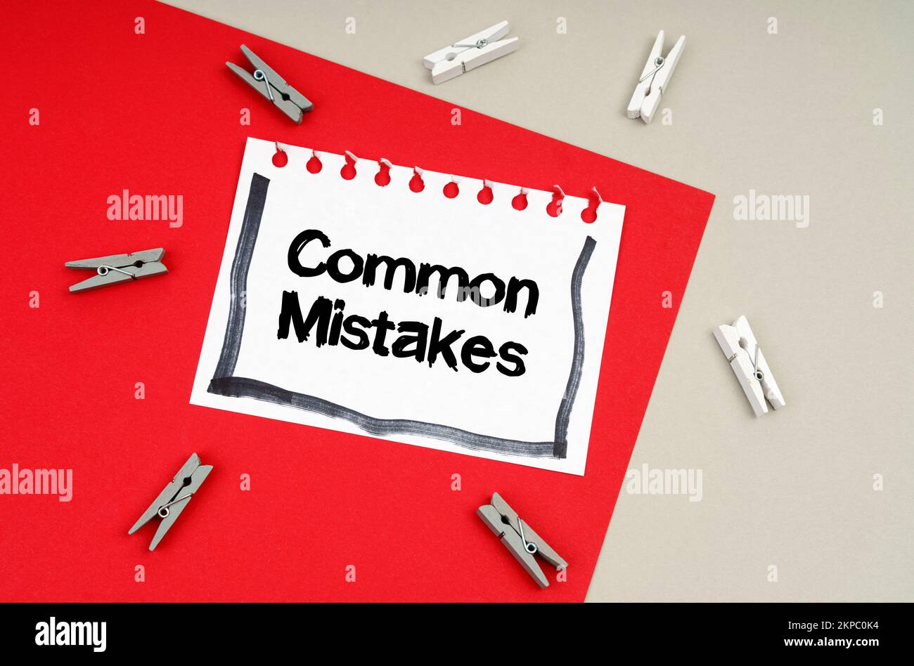 Business and finance concept. Clothespins and a sheet of notebook with ...