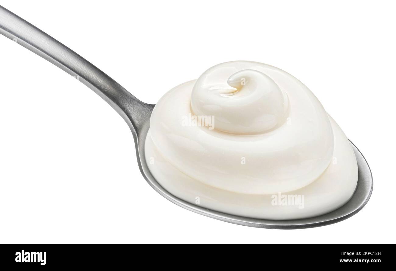 Sour cream in spoon isolated on white background Stock Photo - Alamy