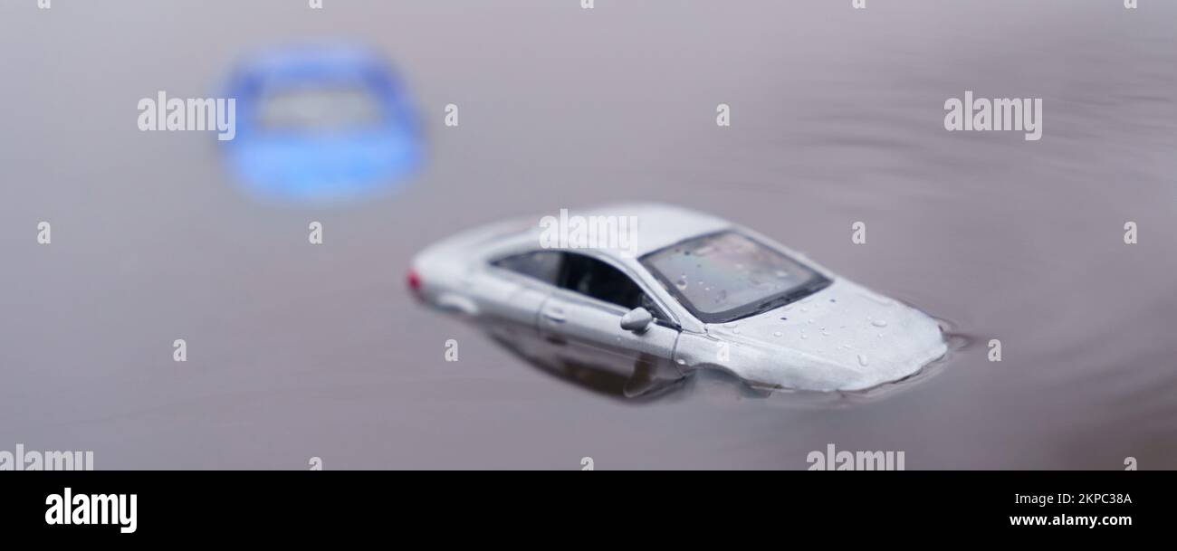 Natural disasters. Two cars were submerged in flooding. One of them is ...