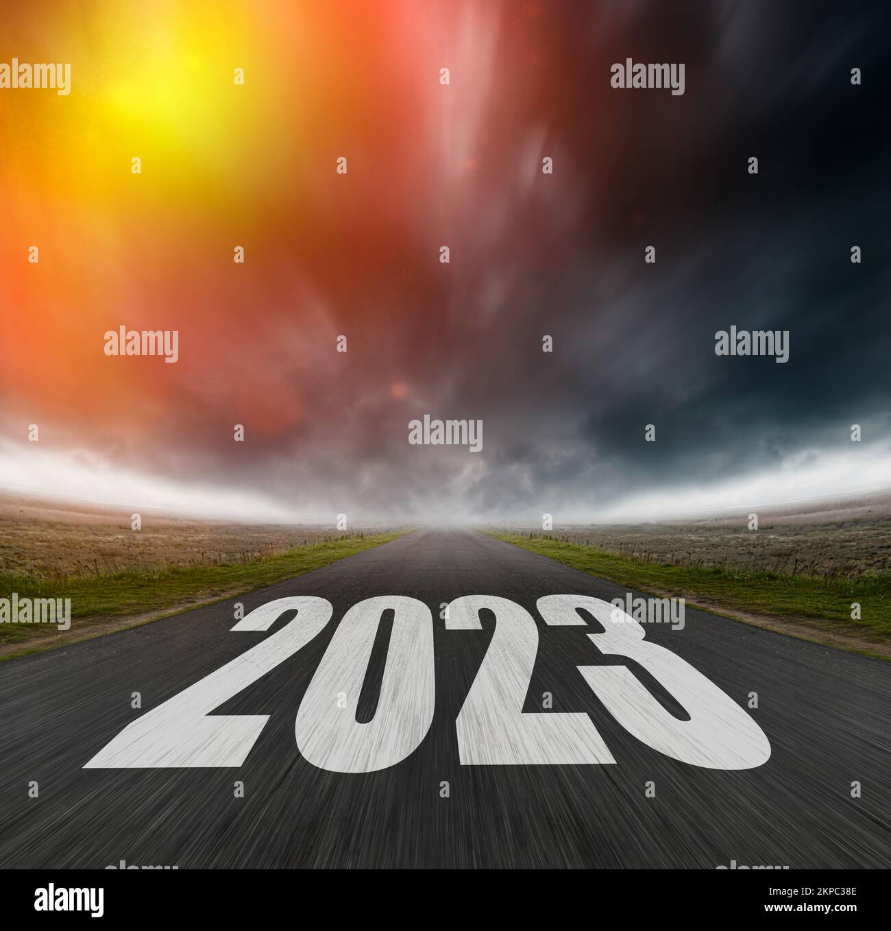 2023 written on highway road in the middle of asphalt road and dark ...