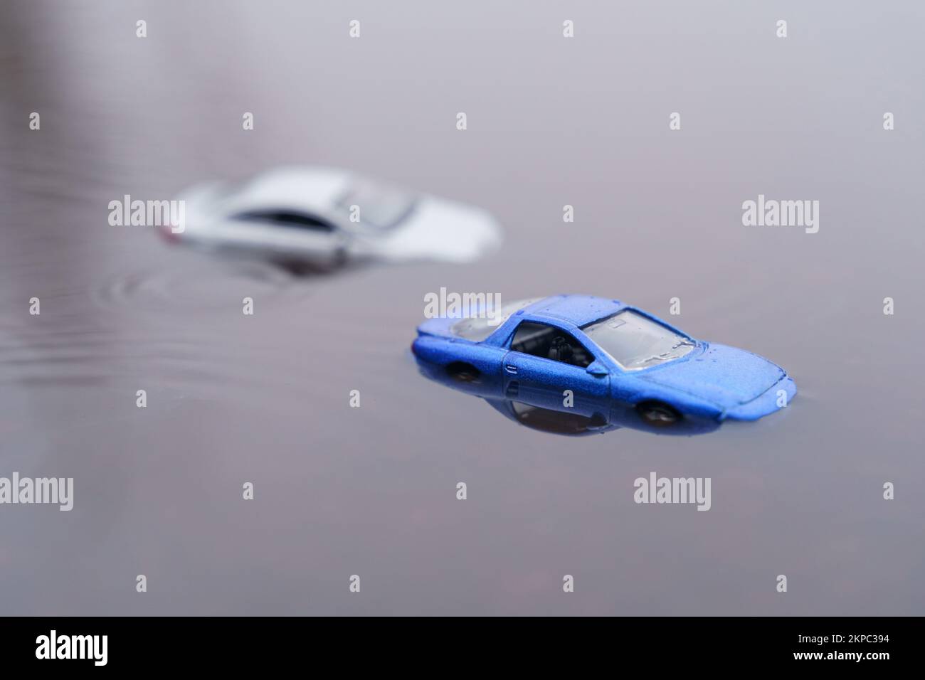 Natural disasters. Two cars were submerged in flooding. One of them is ...