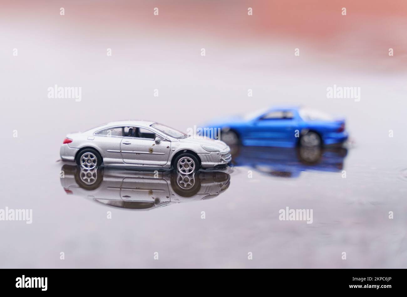 Natural disasters. Two cars are moving along the road after a heavy ...