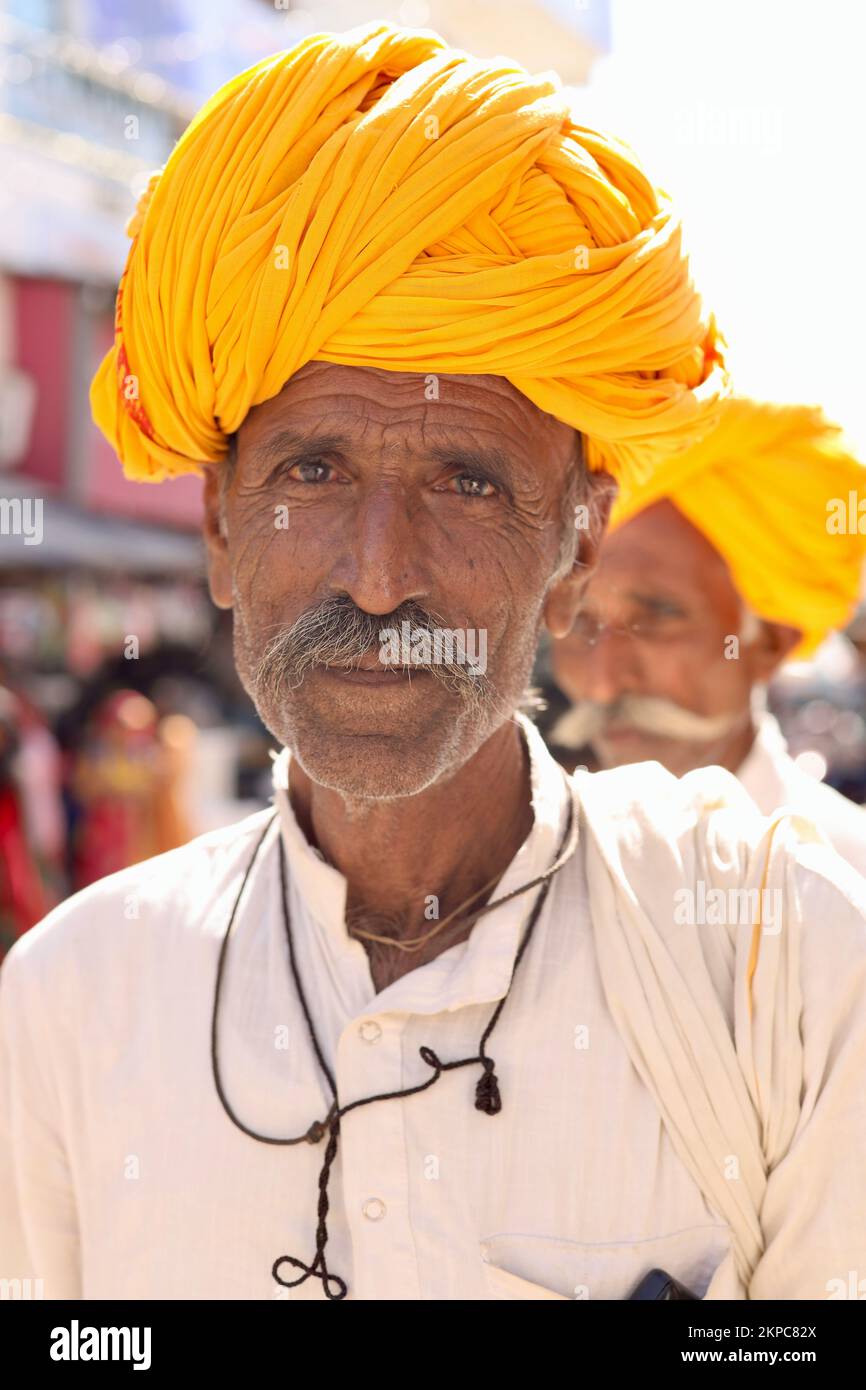 A headshot portrait of a Rajasthani or Marwadi old man in the regional ...