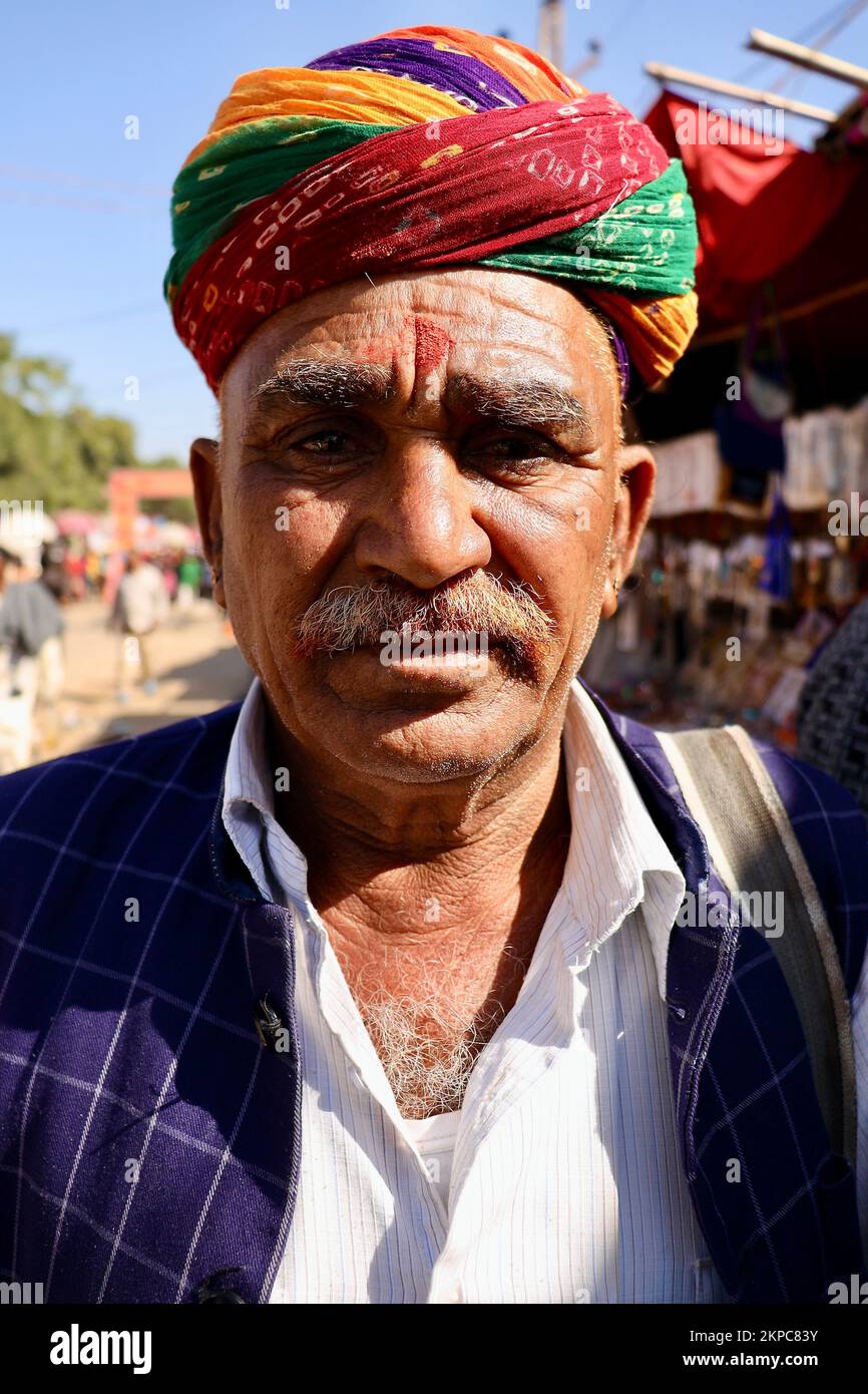 A headshot portrait of a Rajasthani or Marwadi old man in the regional ...