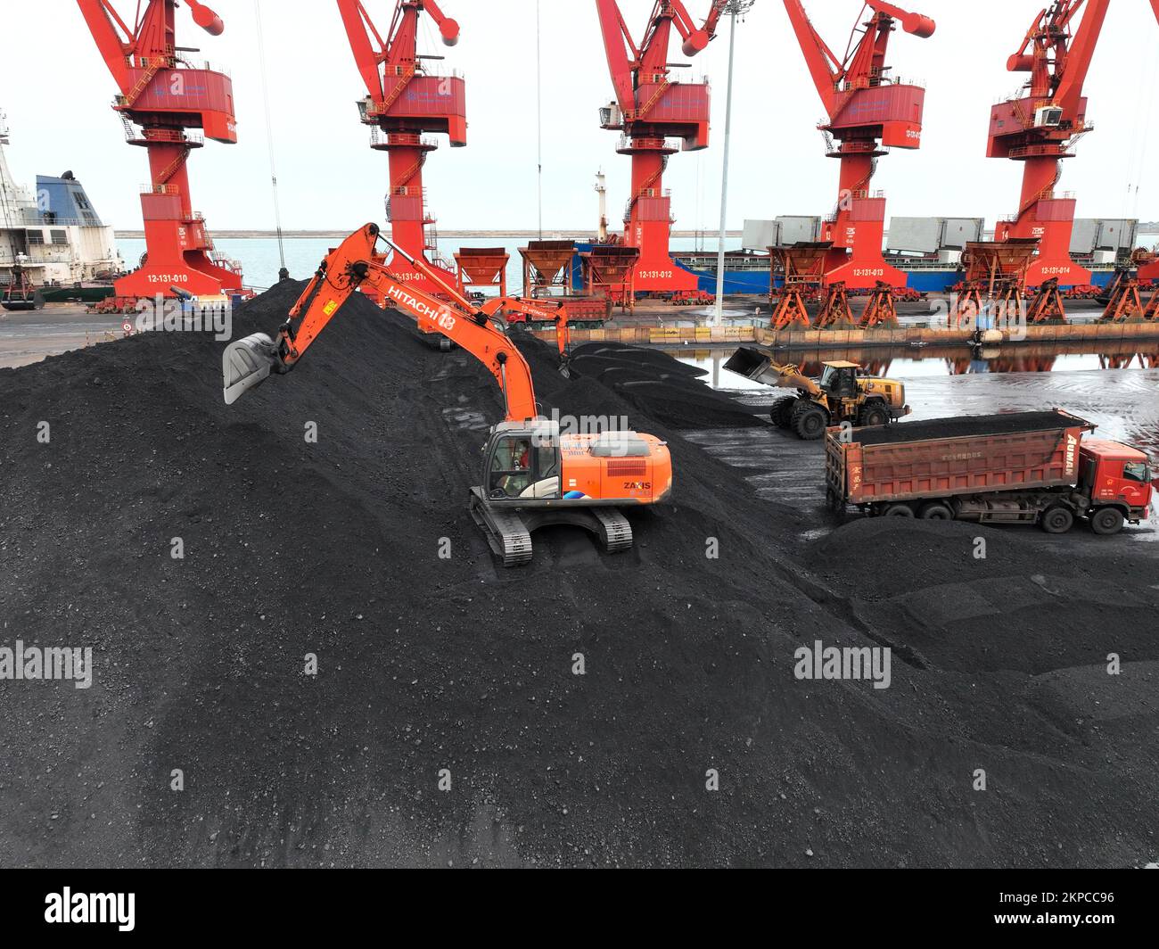 Aerial photo shows the large machinery stacking and storing the thermal ...
