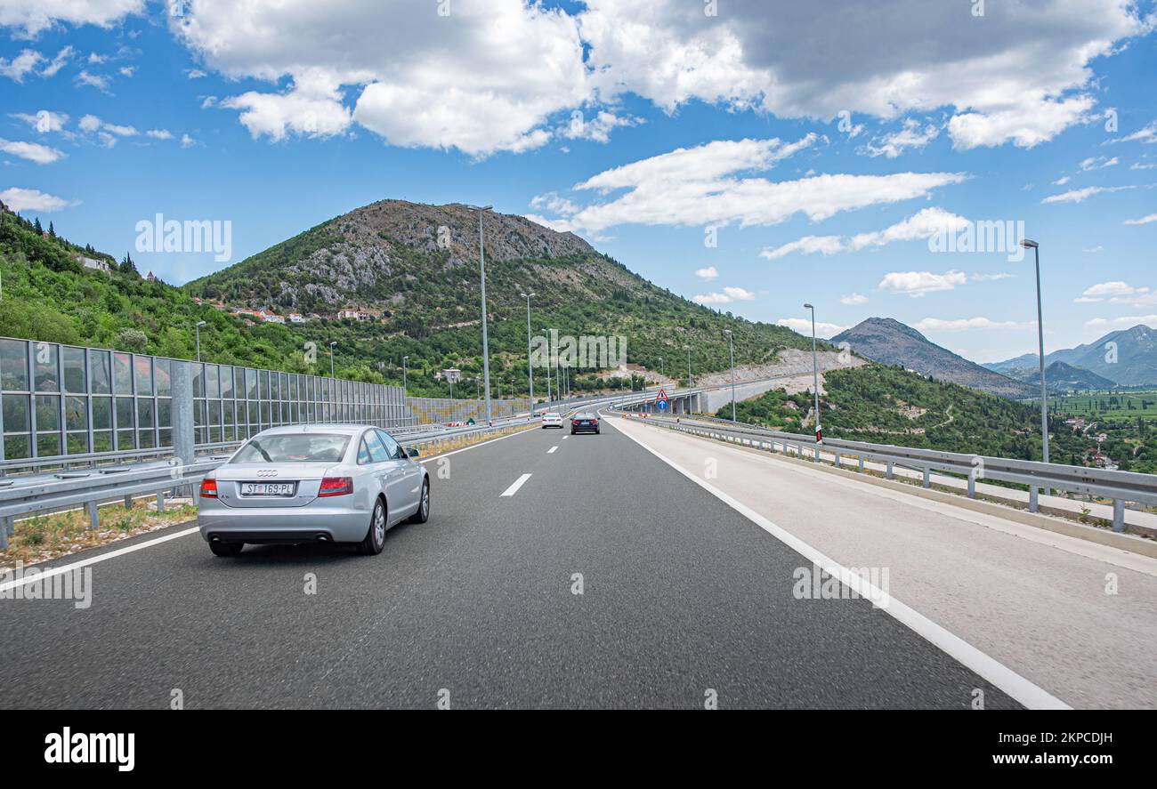 Audi A4 moving on highway among mountain scenery in Plitvice, Croatia ...
