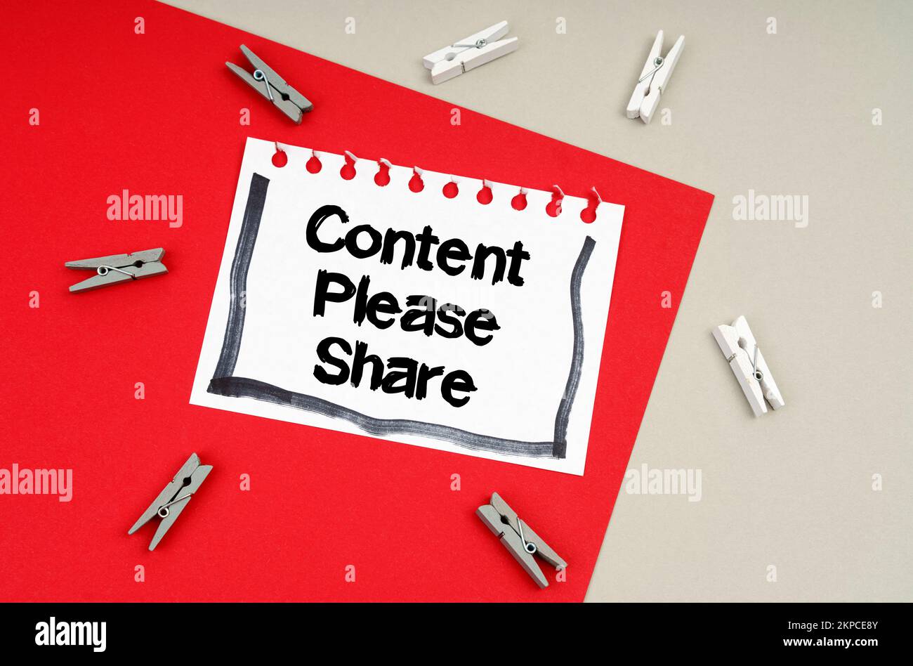 Business and finance concept. Clothespins and a sheet of notebook with ...