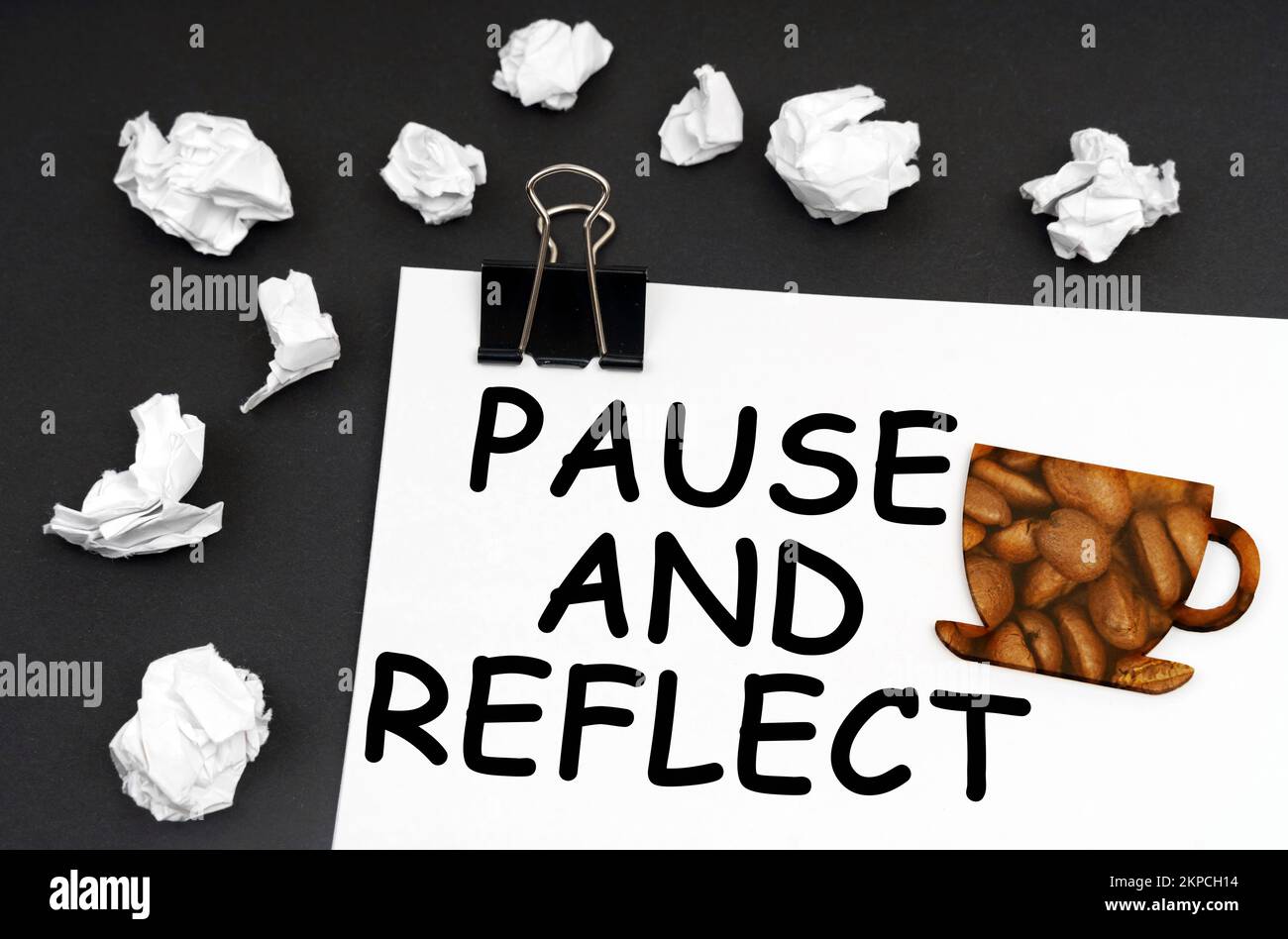 Rest at work. On the black surface is a white sheet with the ...