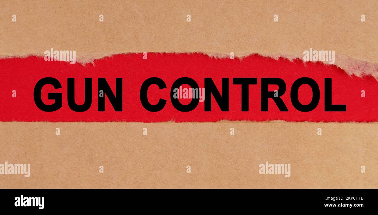 Law concept. Among the torn sheets of paper on a red background, the ...