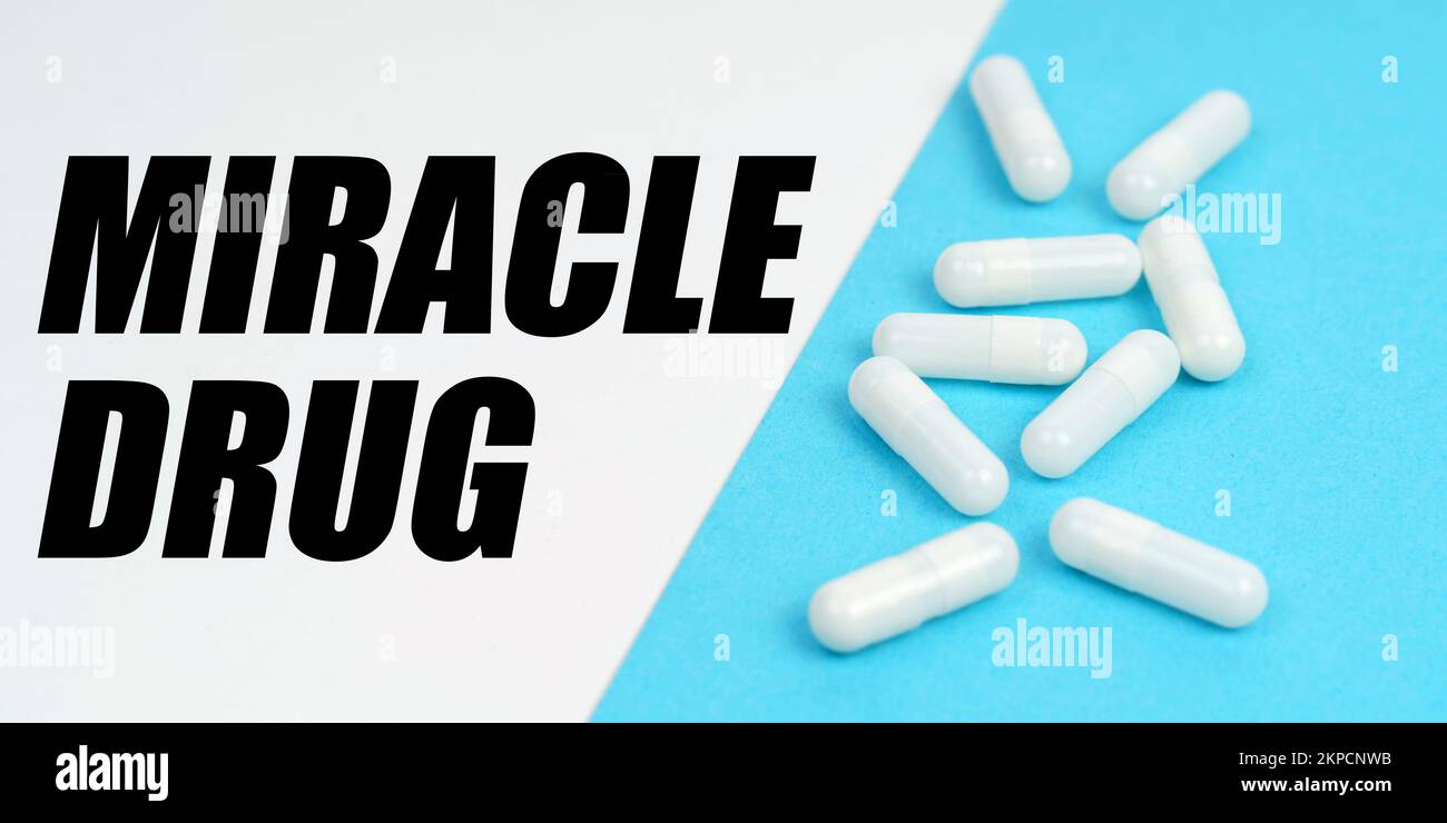 Medicine and health concept. There are pills on the blue surface, on ...