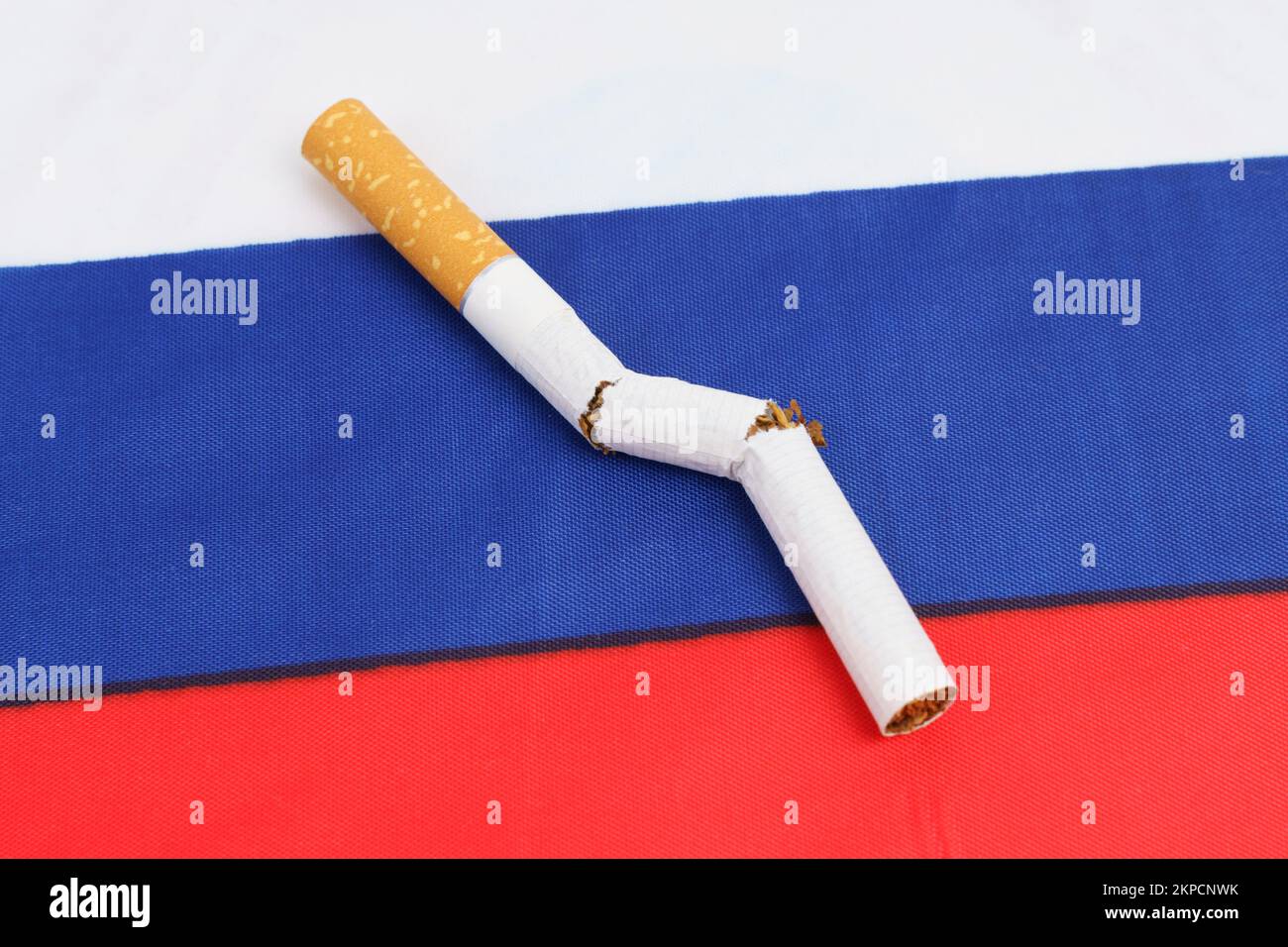 No smoking concept. A broken cigarette is on the flag of Russia, as a ...