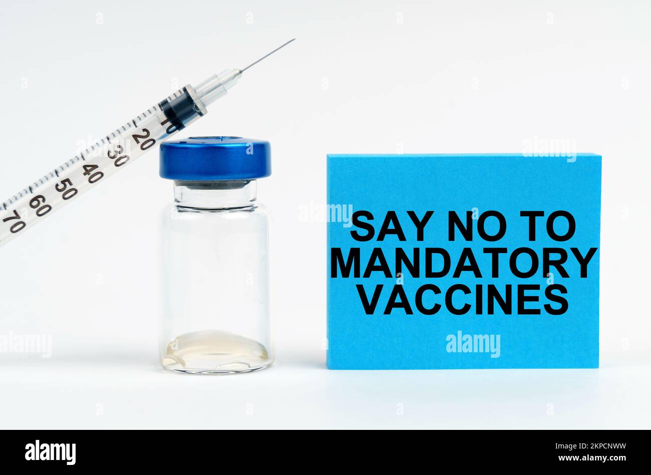 Medicine concept. On the table is a syringe, an injection and a blue ...