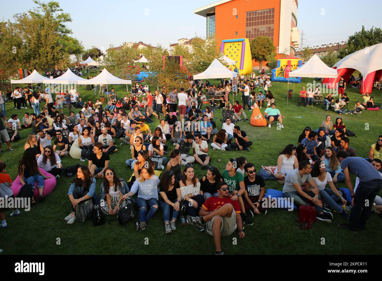 People sitting in the concert area Stock Photo - Alamy