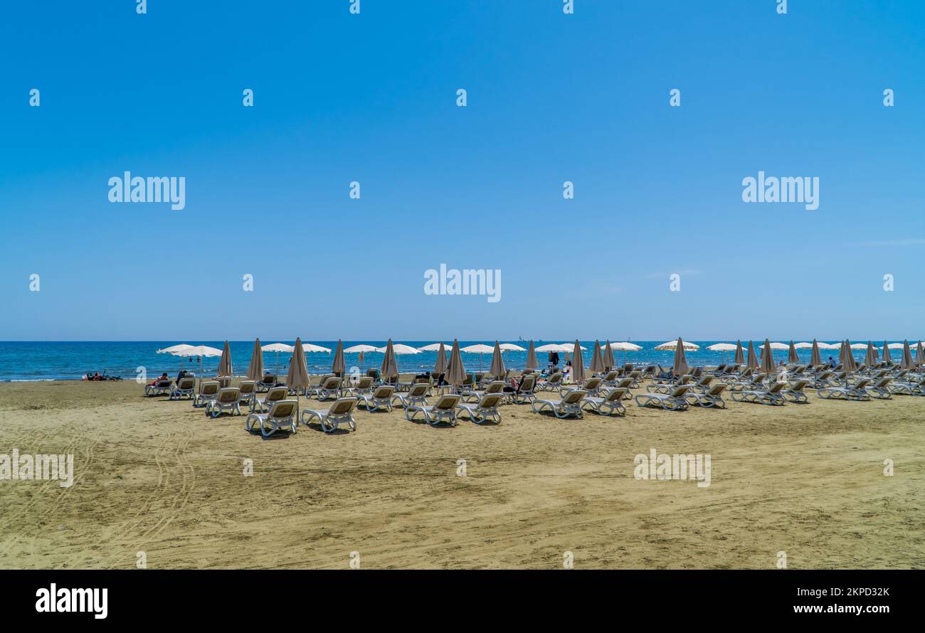 The sun loungers on Finikoudes beach. Larnaca, Cyprus Stock Photo - Alamy