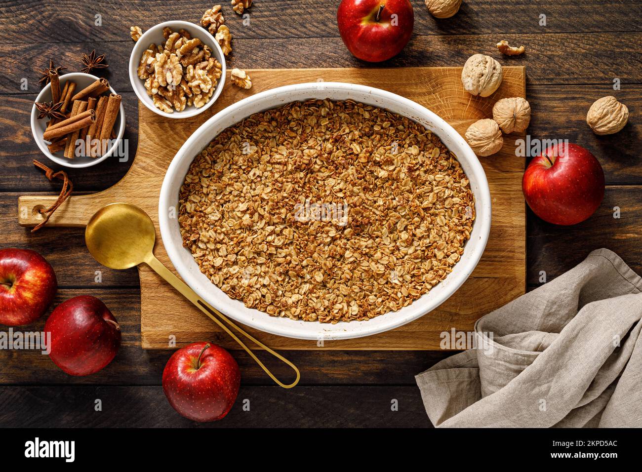 Apple crumble with oatmeal, walnuts and cinnamon. Top view Stock Photo ...