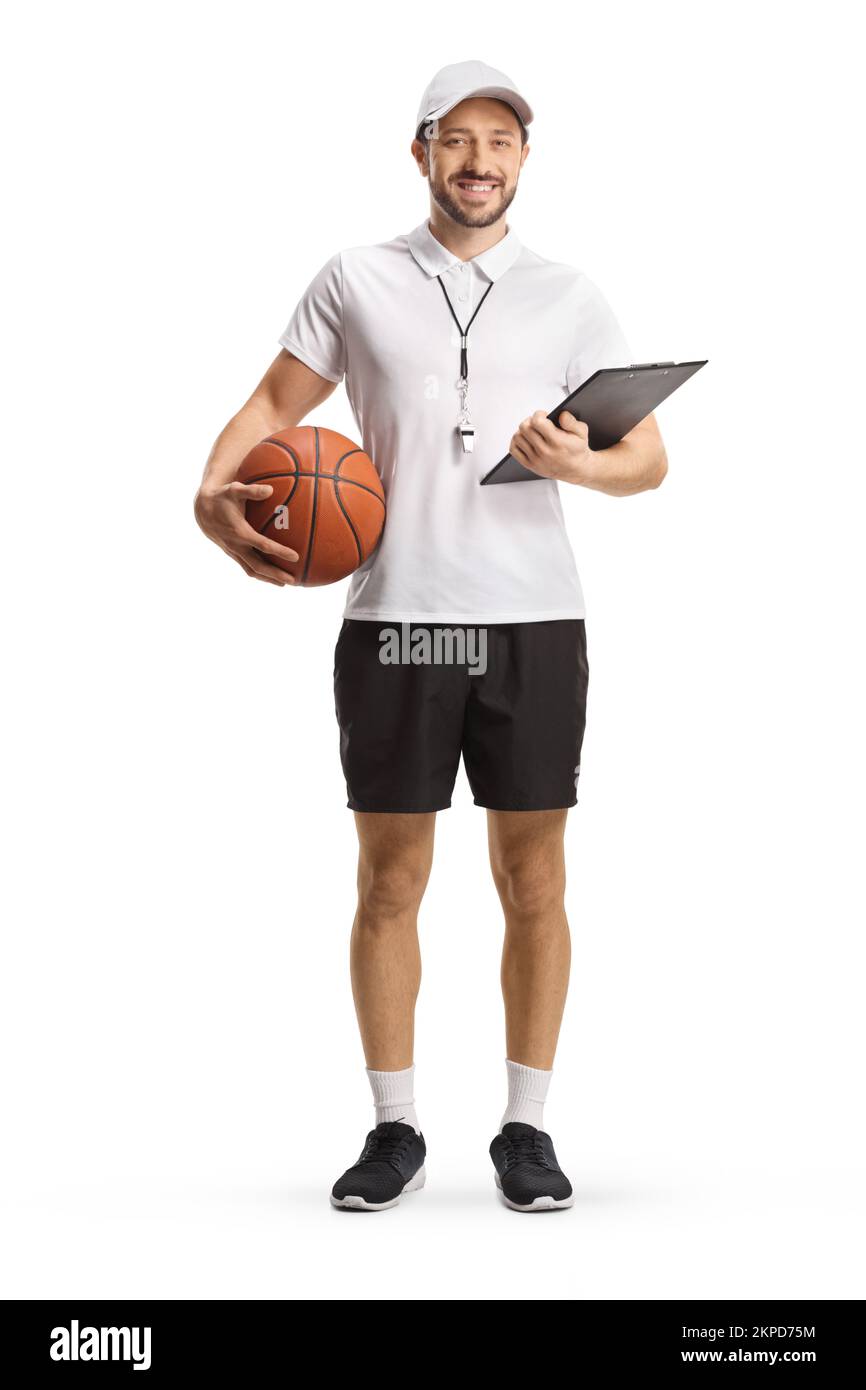 Full length portrait of a basketball coach holding a ball and a ...