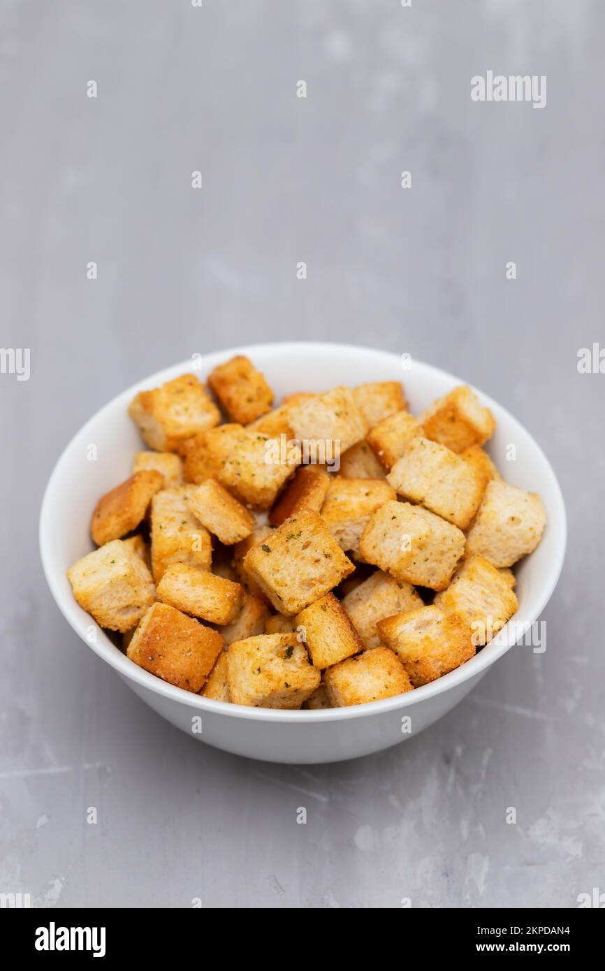 Crispy dry cubes of white bread in white bowl Stock Photo - Alamy