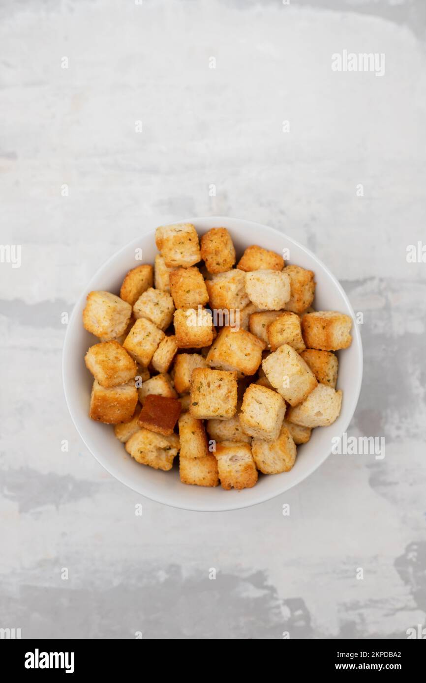 Crispy dry cubes of white bread in white bowl Stock Photo - Alamy