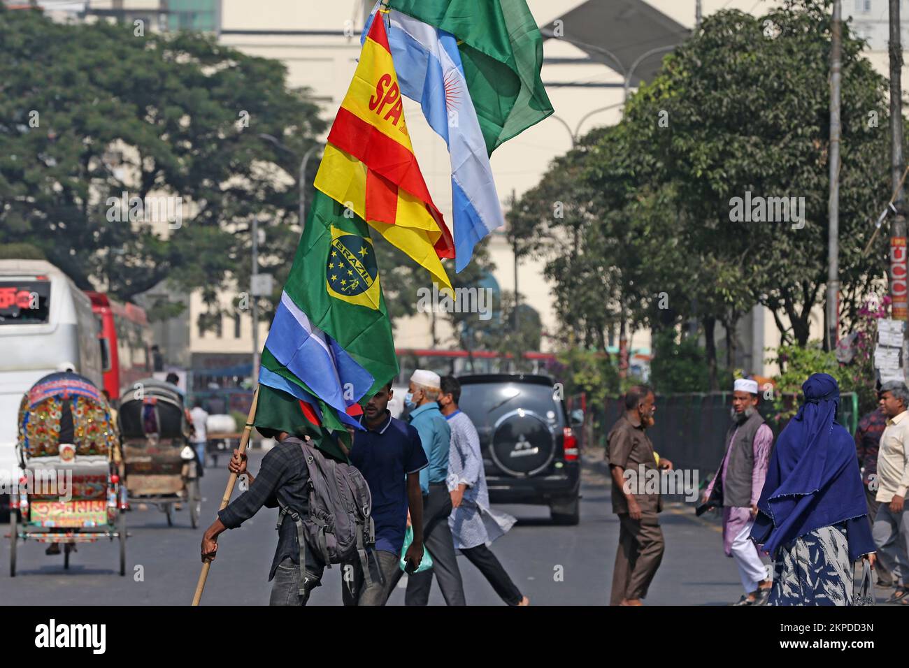 A street vendor carrying flags of the participating nations, dominated ...