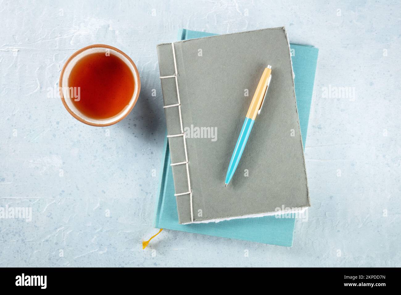 Diary. Journals with a pen and a cup of tea, overhead flat lay shot on ...