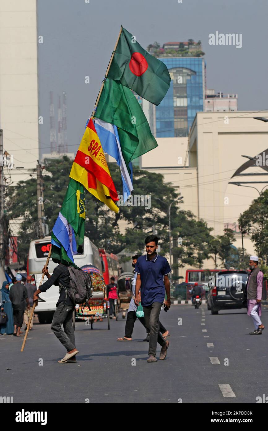 A street vendor carrying flags of the participating nations, dominated ...