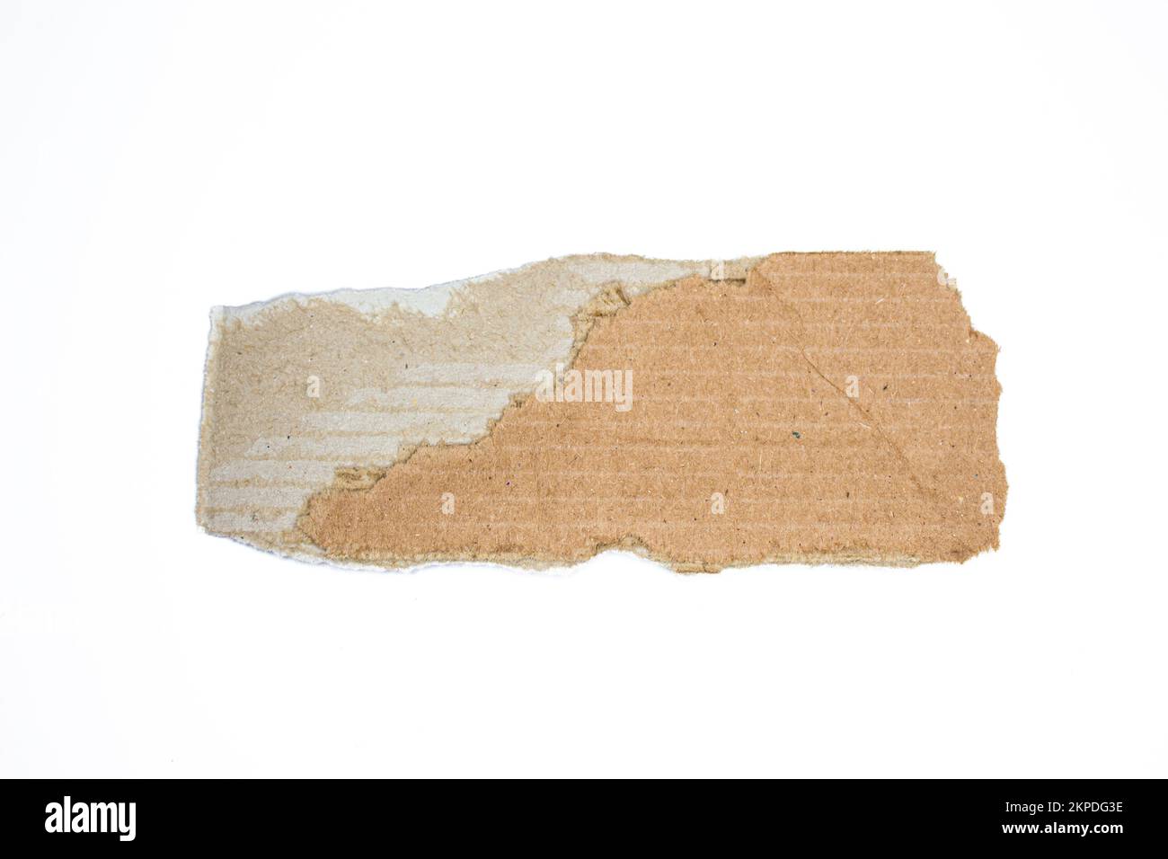 Cardboard piece isolated on white background. Top view of torn ...