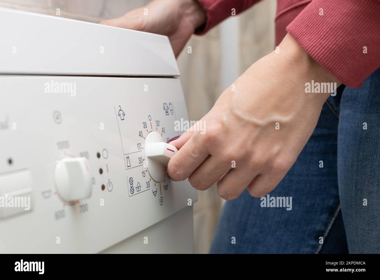 a person chooses a washing mode with a switch. washing mode ...