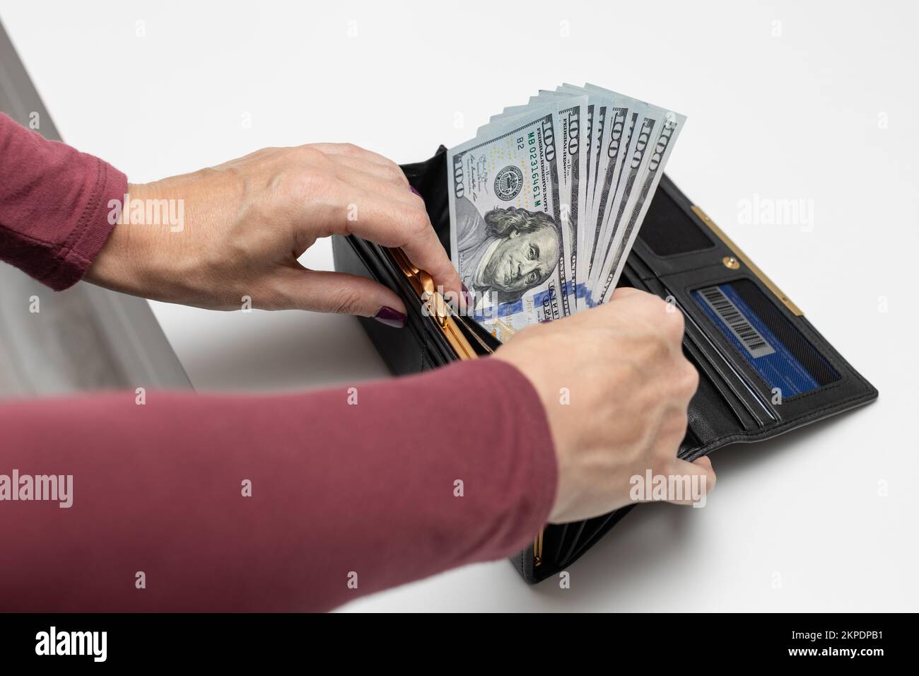 man takes out dollars from his wallet. woman taking money out of wallet ...