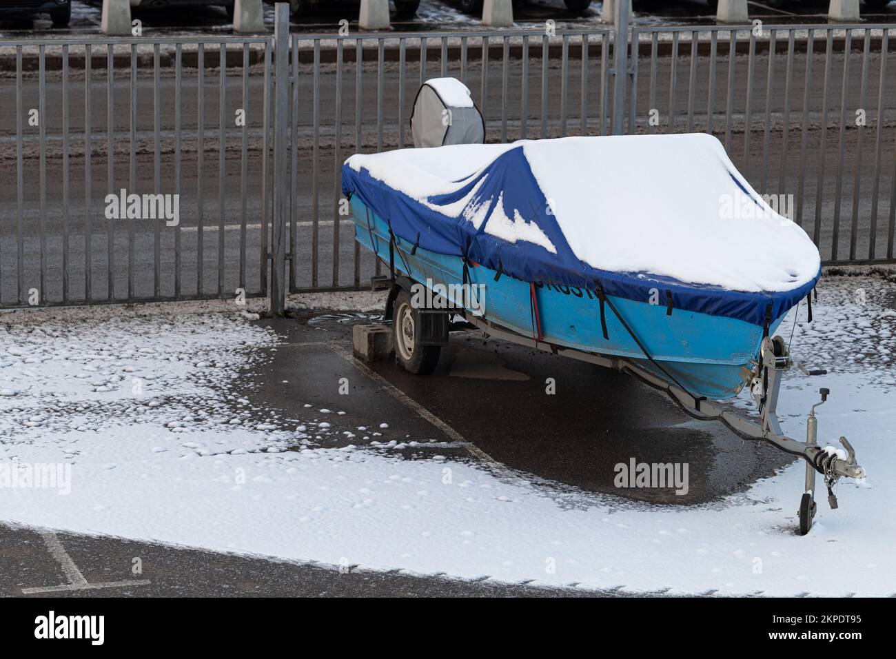 Moscow, Russia - November 16, 2022: boat trailer covered in snow. boat ...