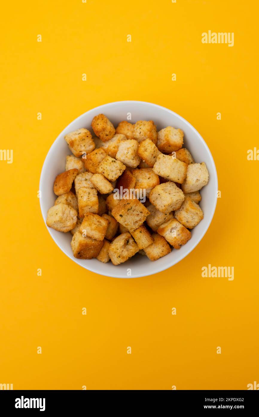 Crispy dry cubes of white bread in white bowl Stock Photo - Alamy