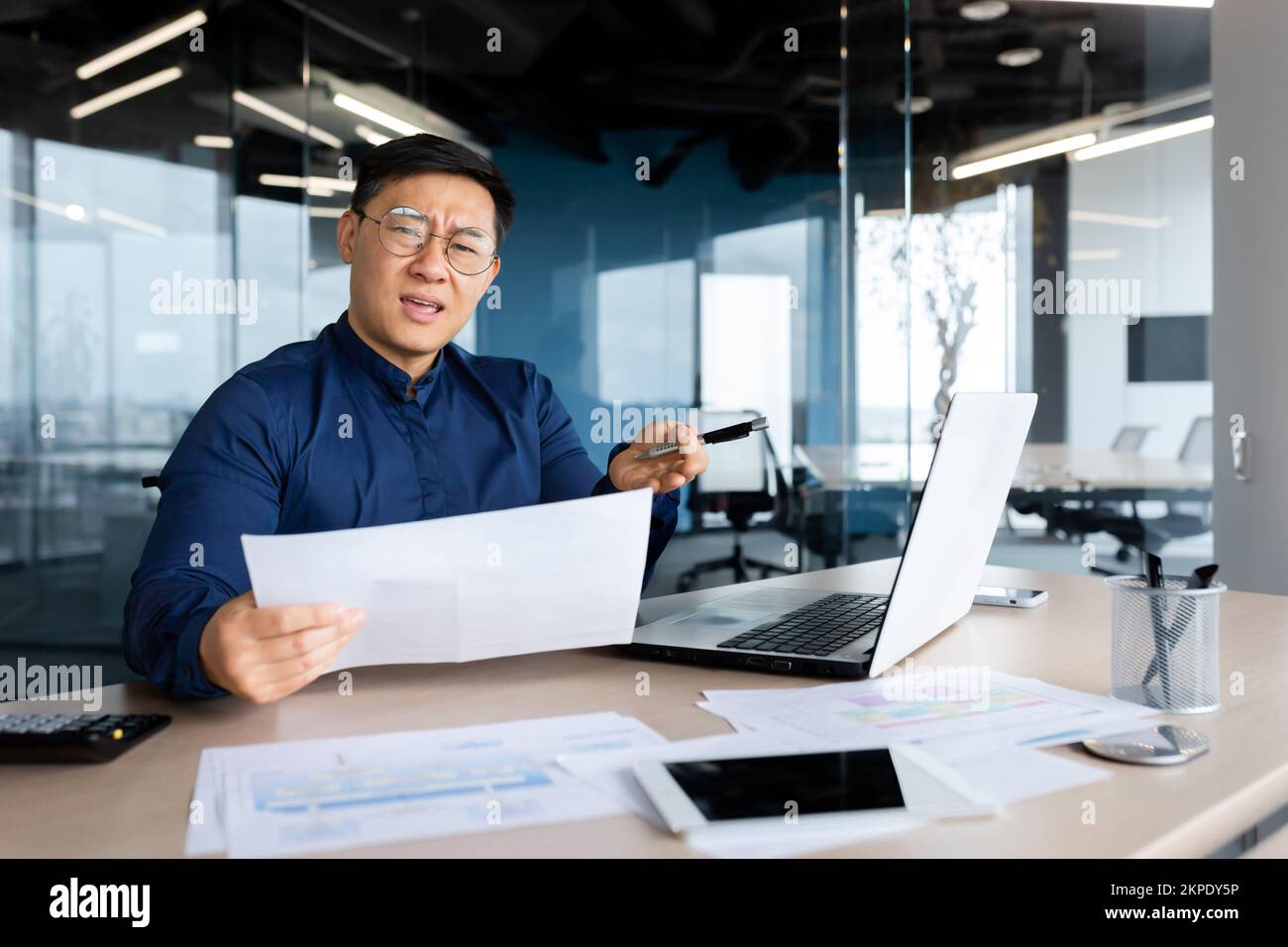 Portrait upset and disappointed Asian man, financier accountant doing ...