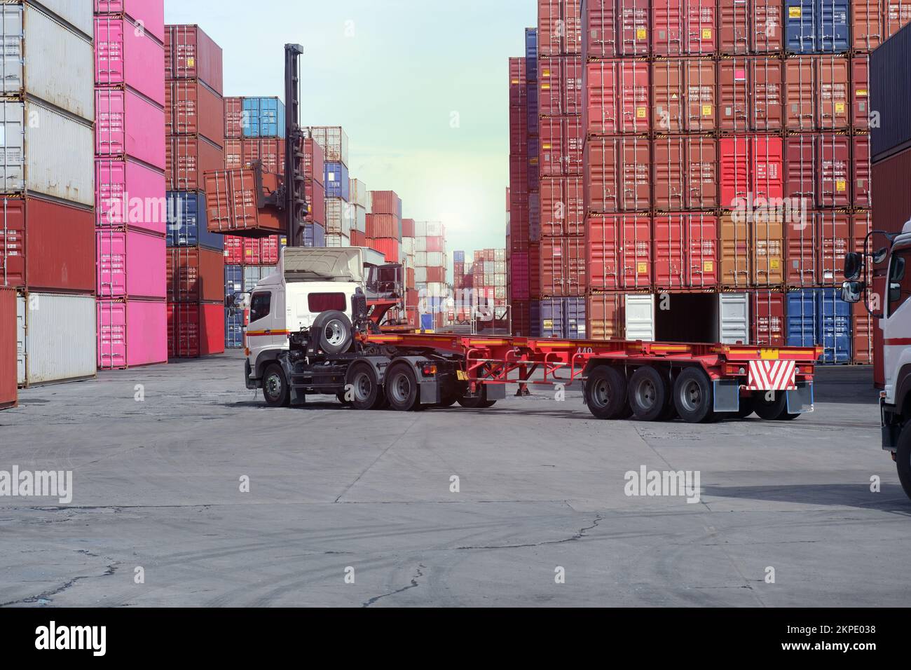Trucks in the container yard Stock Photo - Alamy