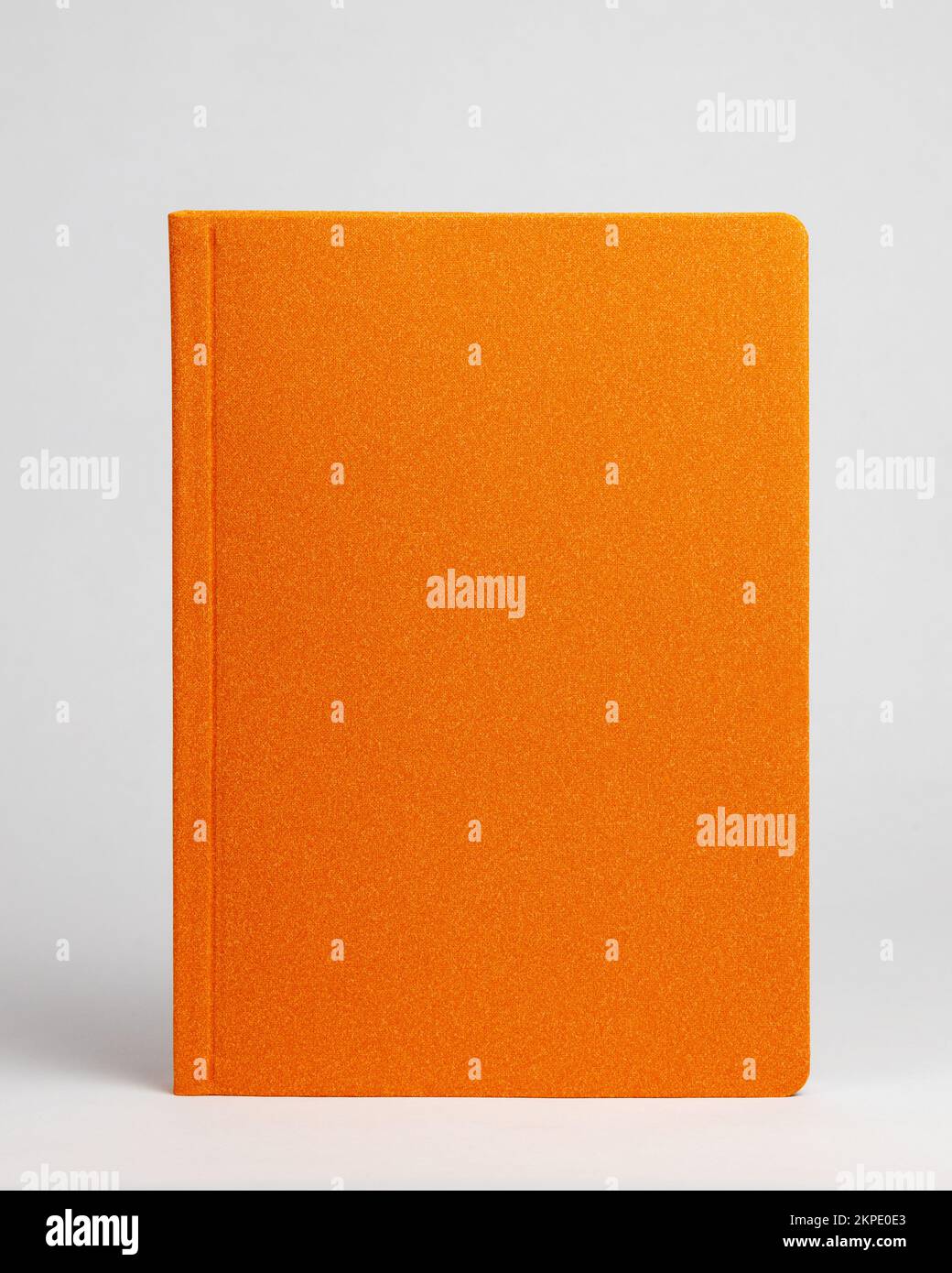 Closed orange notebook hi-res stock photography and images - Alamy
