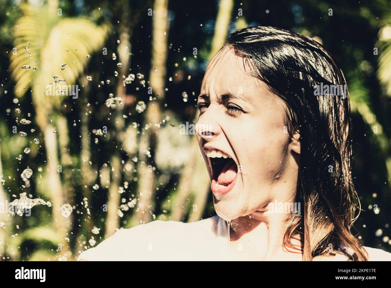 Caucasian girls playing in sprinkler hi-res stock photography and ...