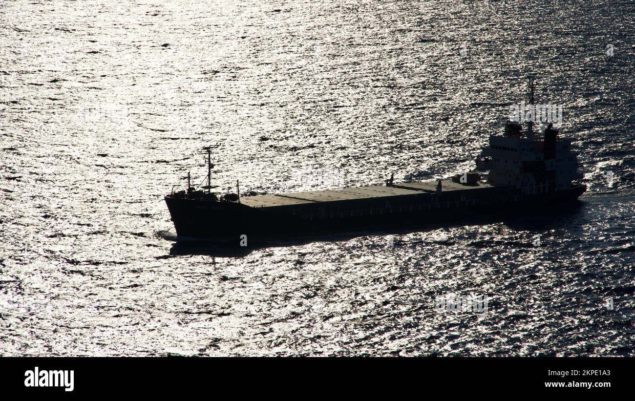 Cargo ship at sea. transit ship. Sailboats. Fishing boat. Fishing ...