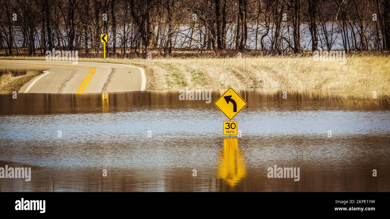 A closeup of a half drowning street sign from the flooding Stock Photo ...