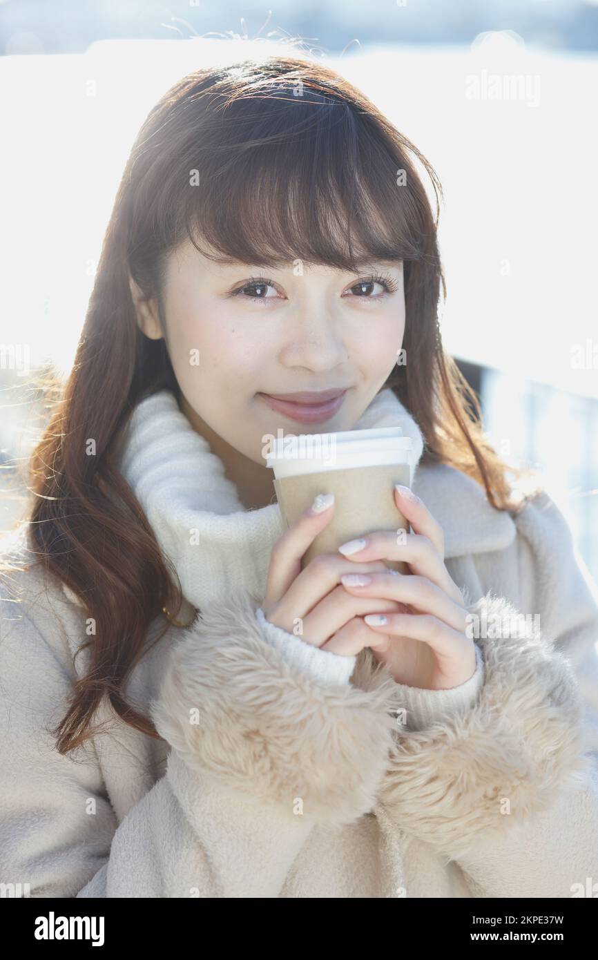 Japanese woman relaxing outside Stock Photo - Alamy