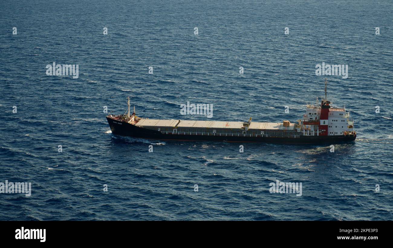 Cargo ship at sea. transit ship. Sailboats. Fishing boat. Fishing ...
