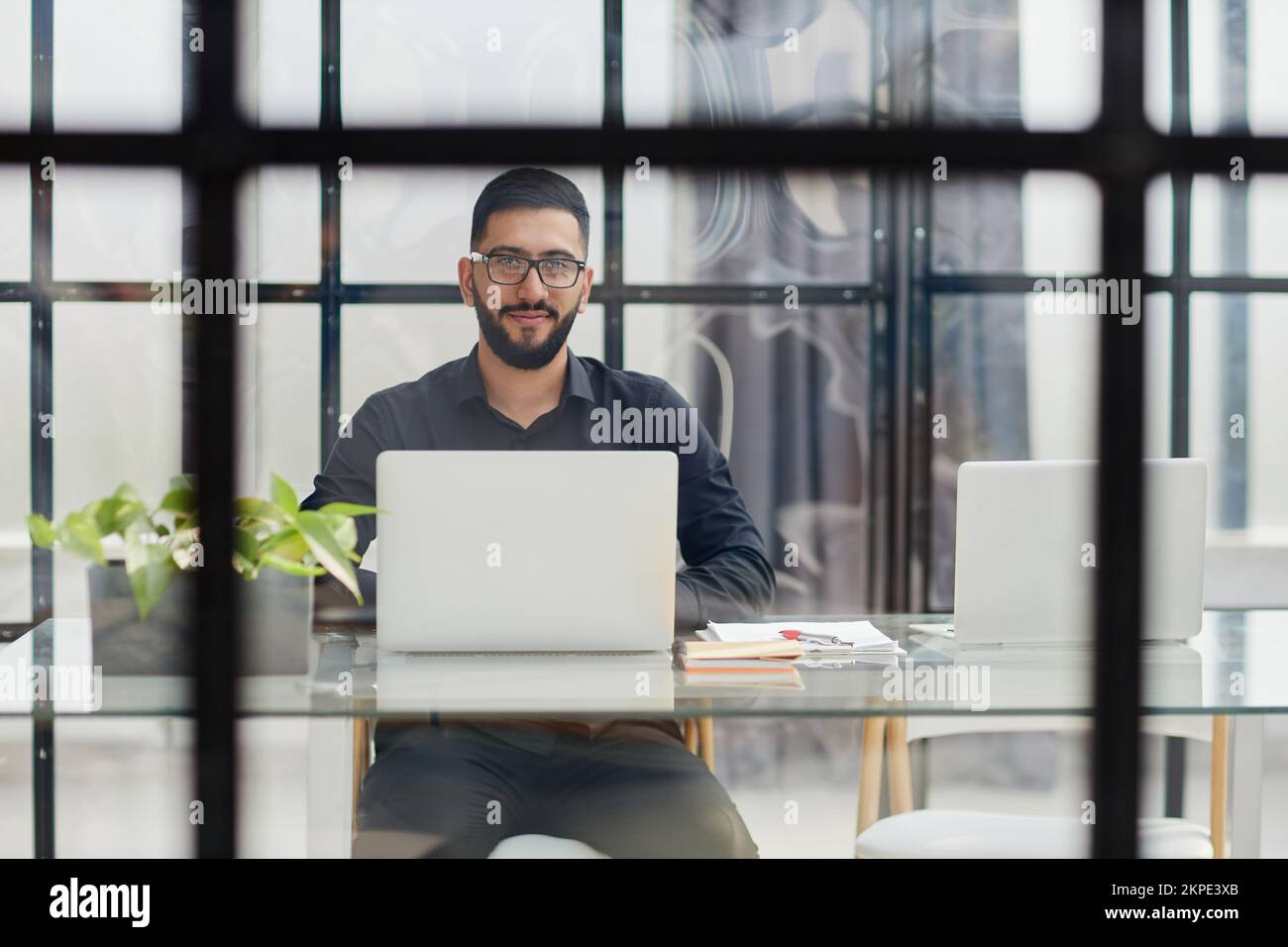 Middle-aged man working on laptop in office Stock Photo - Alamy