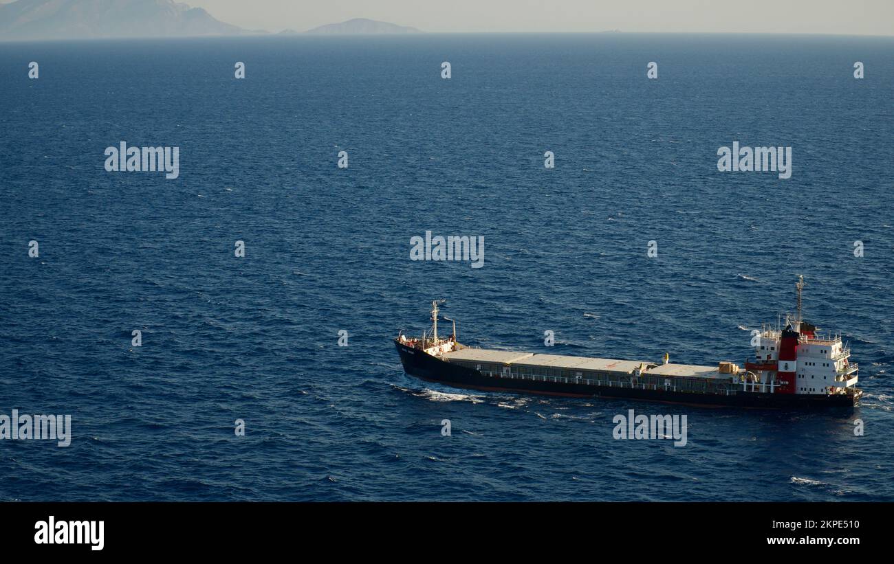 Cargo ship at sea. transit ship. Sailboats. Fishing boat. Fishing ...