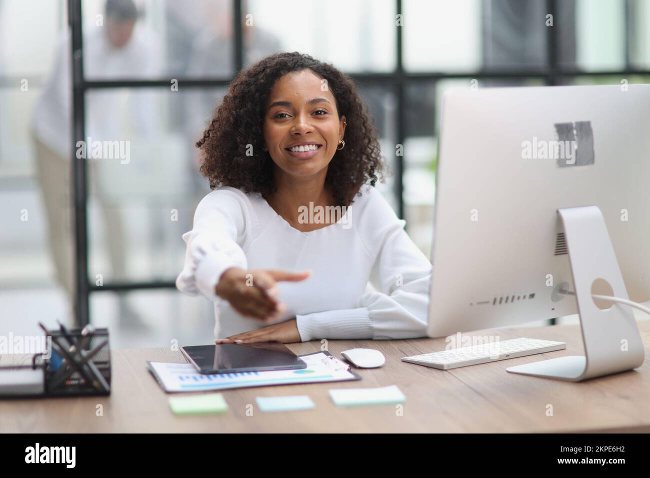 businesswoman offering handshake, standing with extended hand in Stock ...