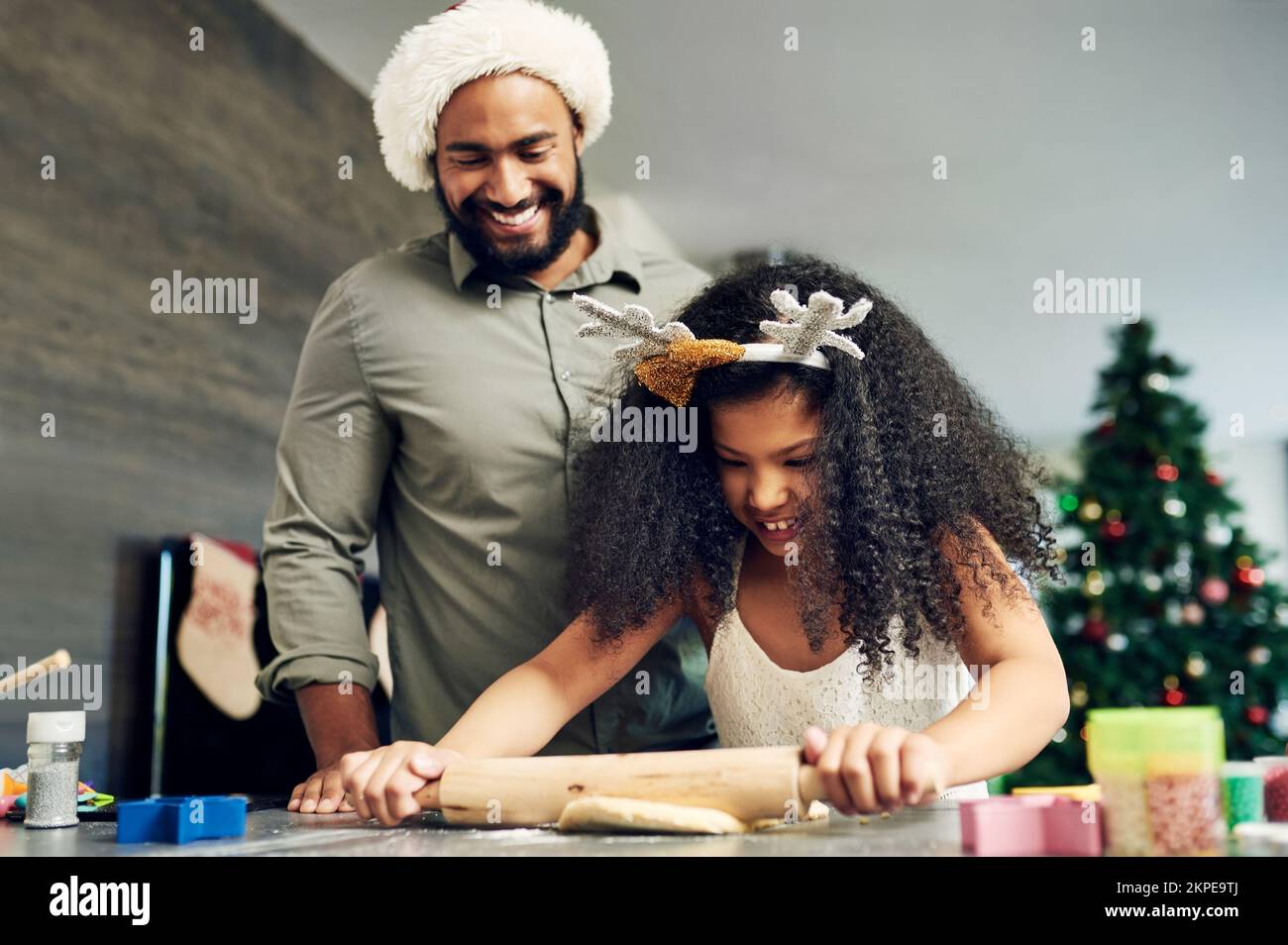 Christmas, cookie baking and family with happiness and bonding of a dad ...