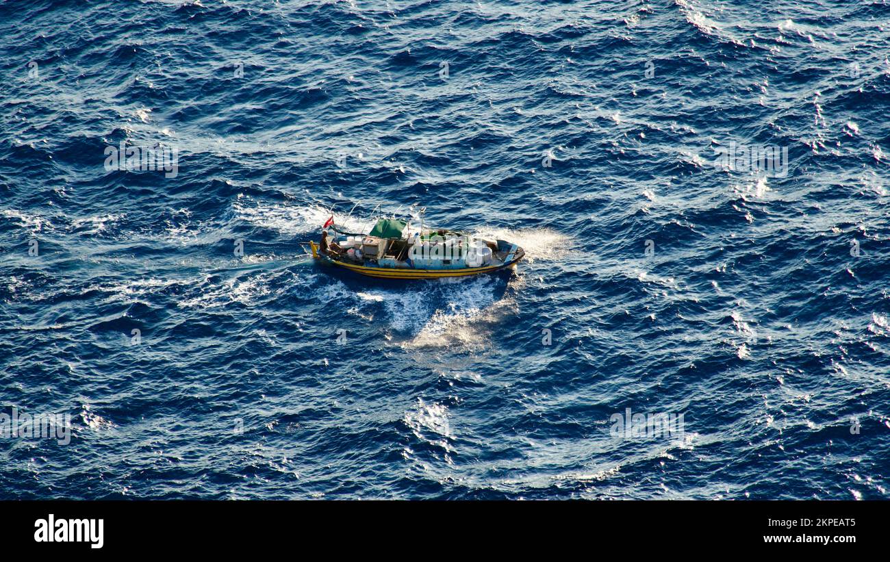 Cargo ship at sea. transit ship. Sailboats. Fishing boat. Fishing ...