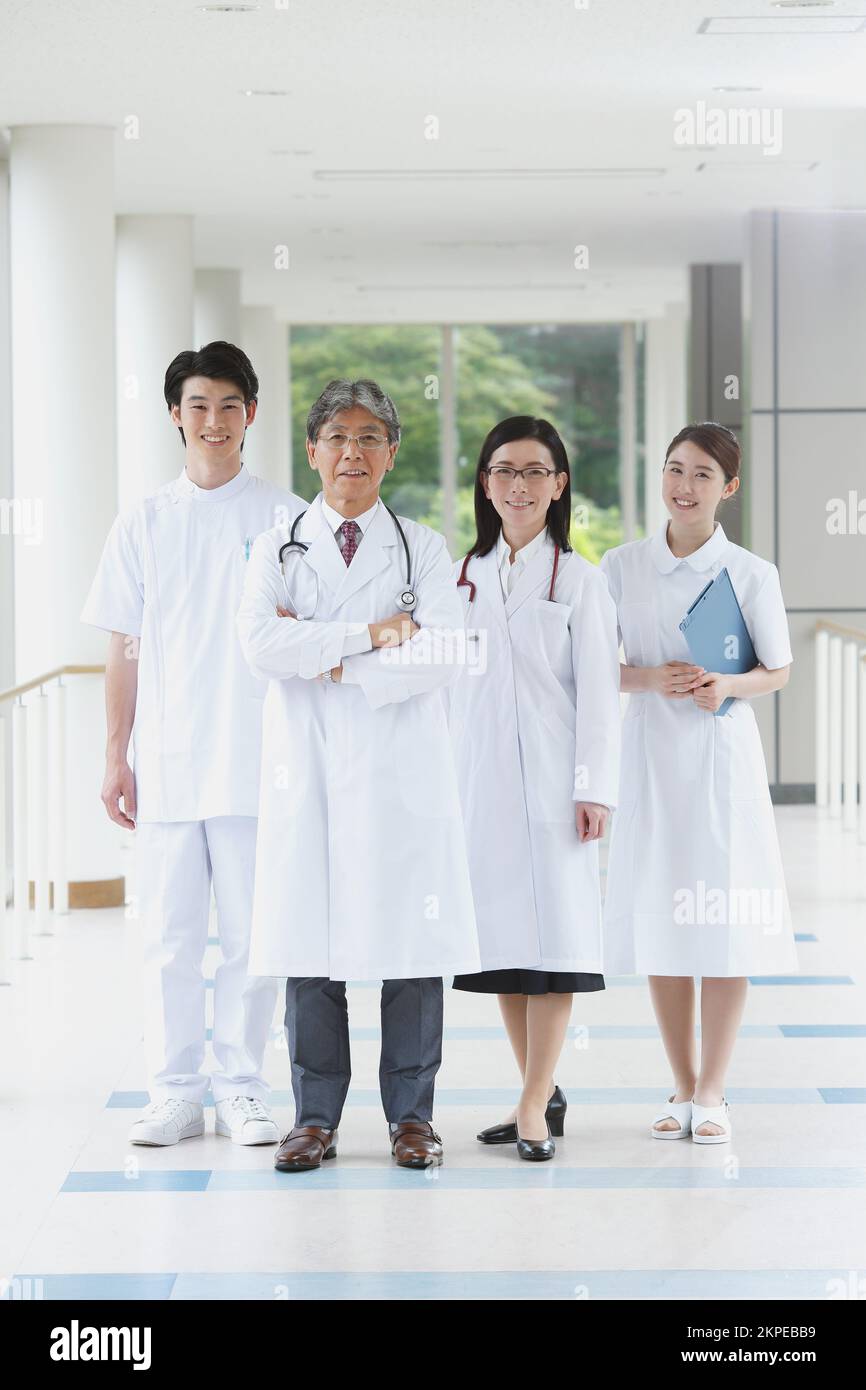 Medical team smiling in the hallway Stock Photo - Alamy